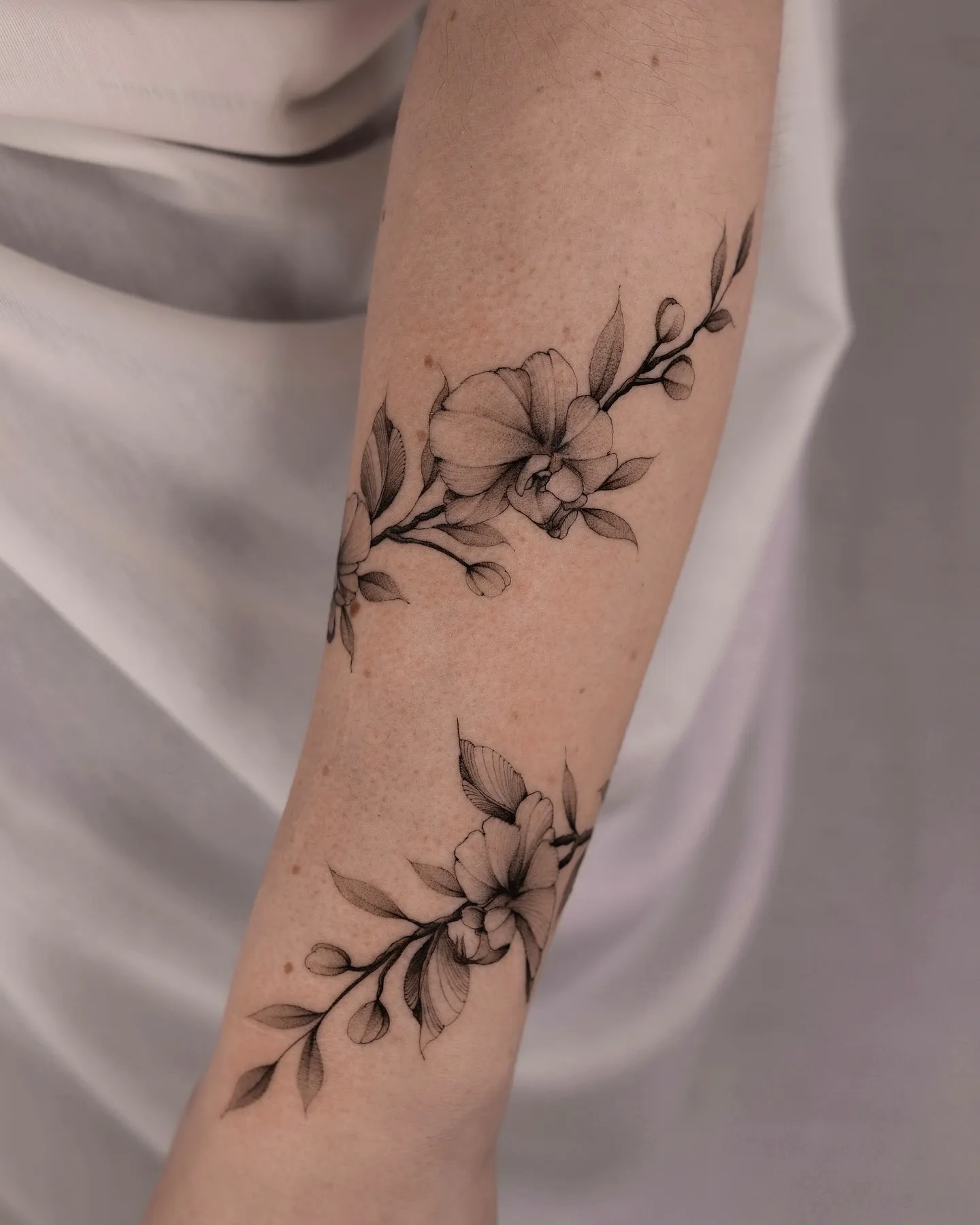 15 Striking Orchid Tattoo Ideas for Unique Body Art